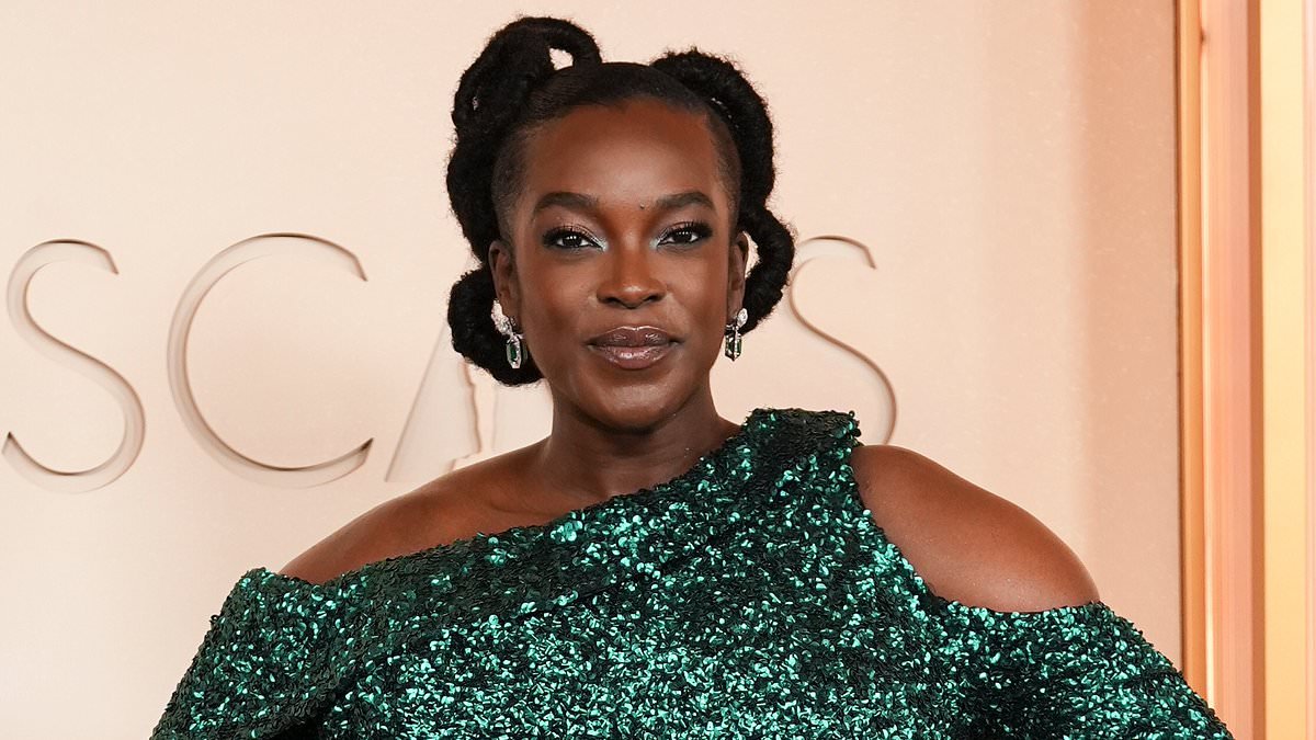 Sinners' star and Supporting Actress nominee Wunmi Mosaku cradles her ...